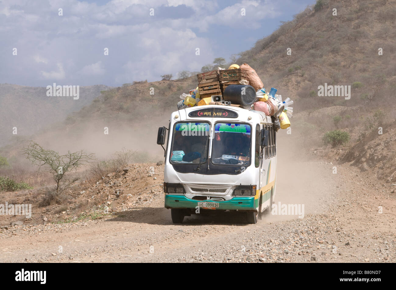 Loaded bus on a dusty road in Southern Ethiopia Africa Stock Photo - Alamy
