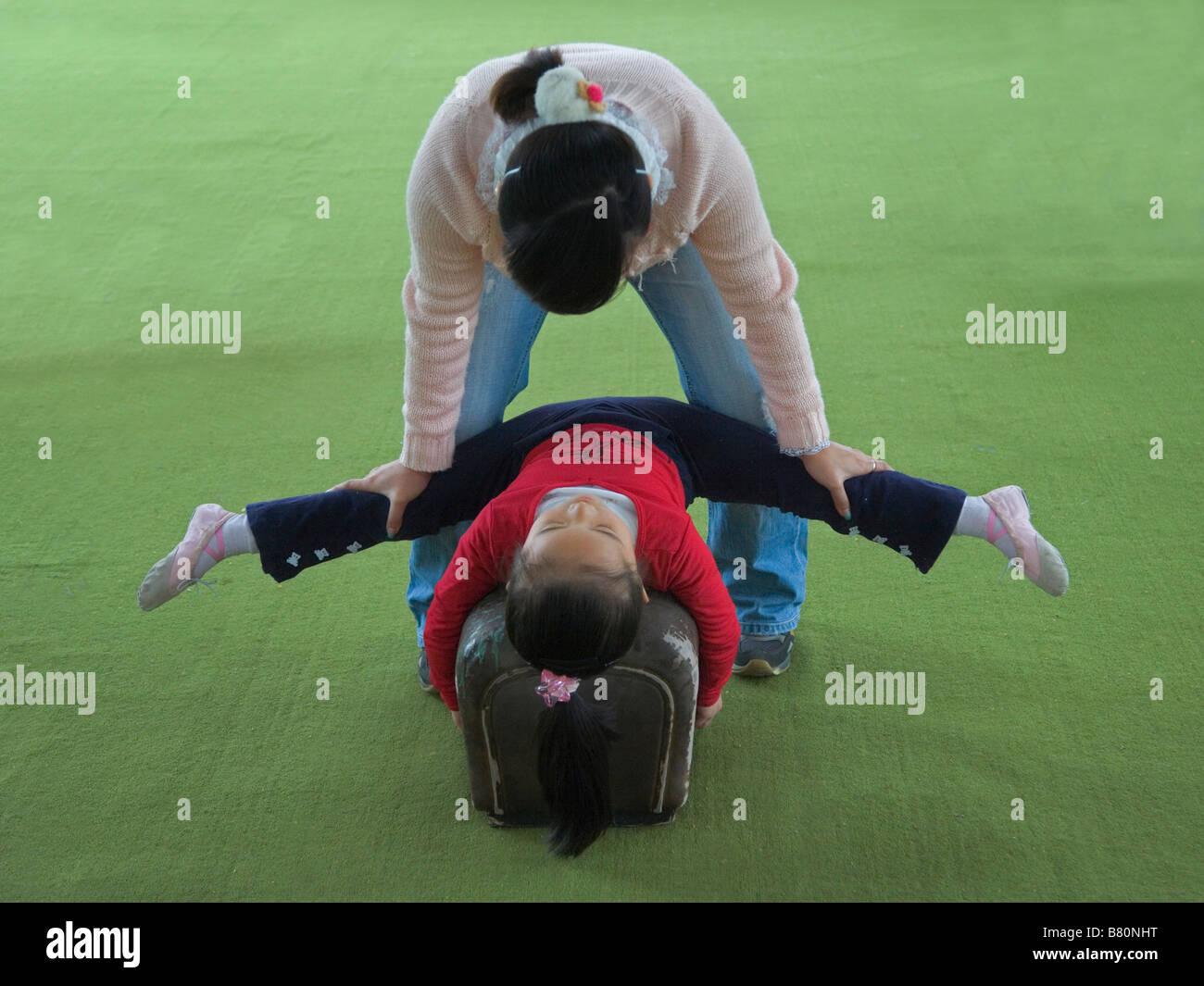 Children receiving gymnastics training China Stock Photo - Alamy