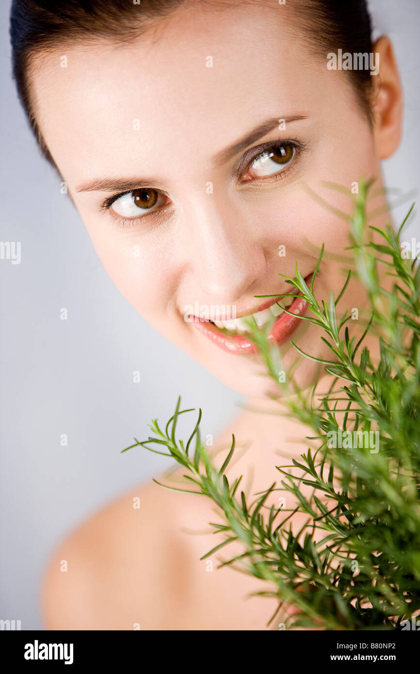 Young woman holding bunch of rosemary smiling head and shoulder Stock ...