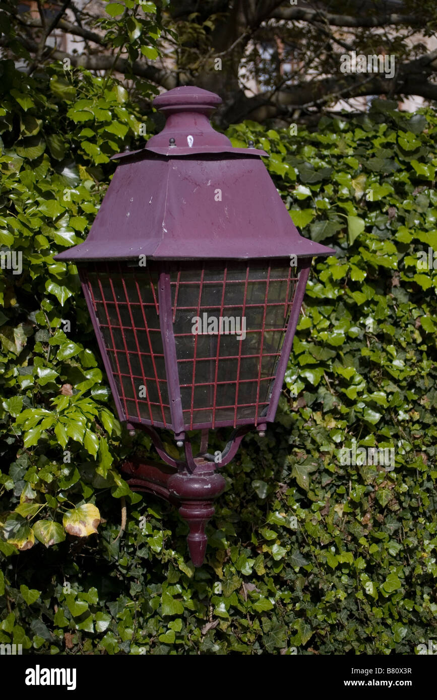 Old street lamp on a wall with creeper Stock Photo - Alamy