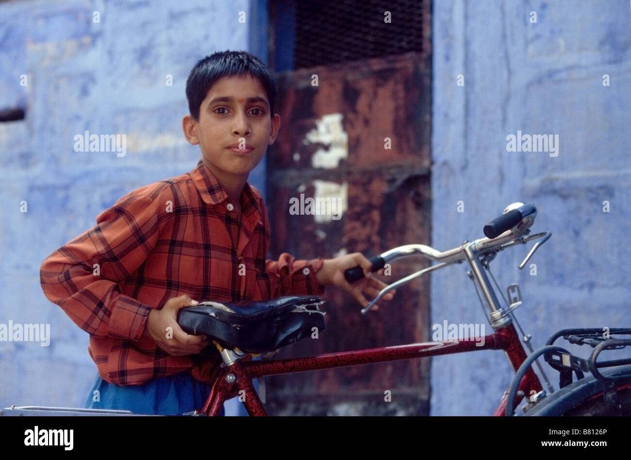 Portrait of an Indian boy with a bike Stock Photo - Alamy