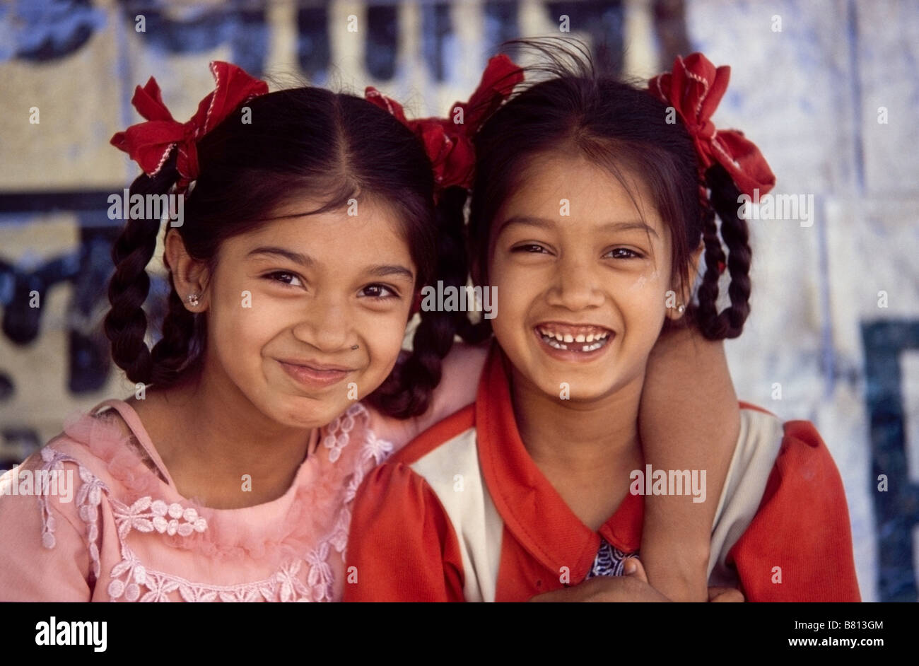 Two cheeky Indian girls Stock Photo - Alamy