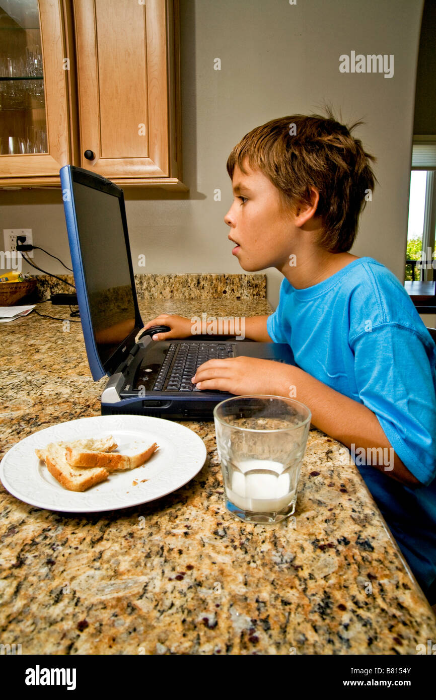Year old boy uses computer hi-res stock photography and images - Alamy