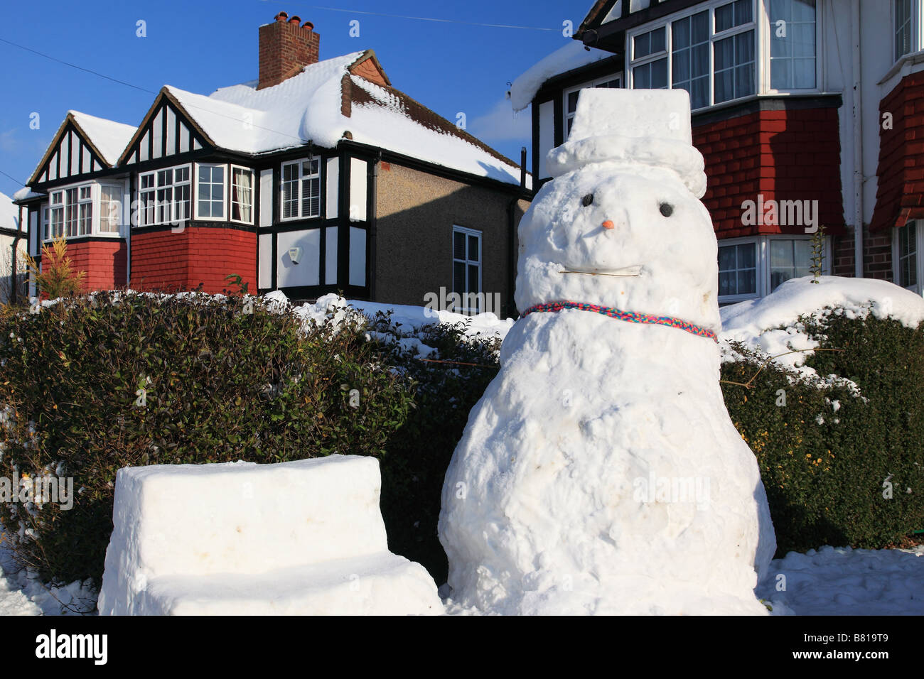 Snowman outside typical English house in Surrey New Malden England ...