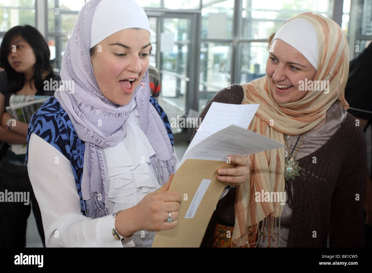 Students opening and comparing A-Level exam results Stock Photo - Alamy