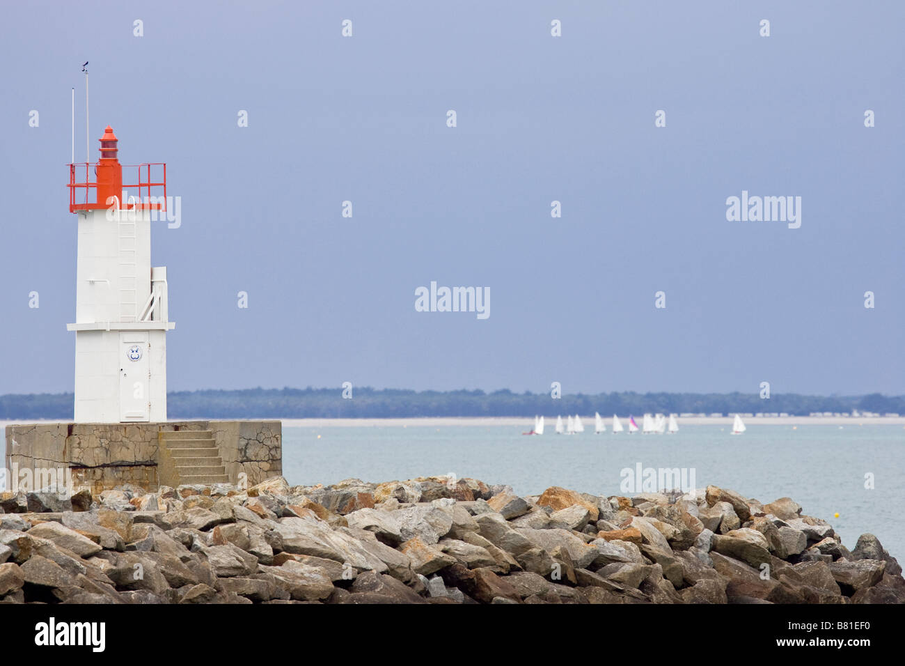 The lighthouse at the entry of the port Stock Photo - Alamy