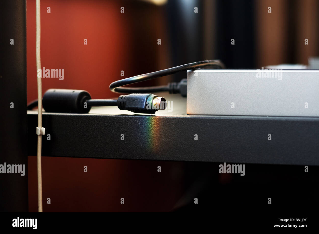 Side view of silver external hard disk with cables on rack shelf Stock ...