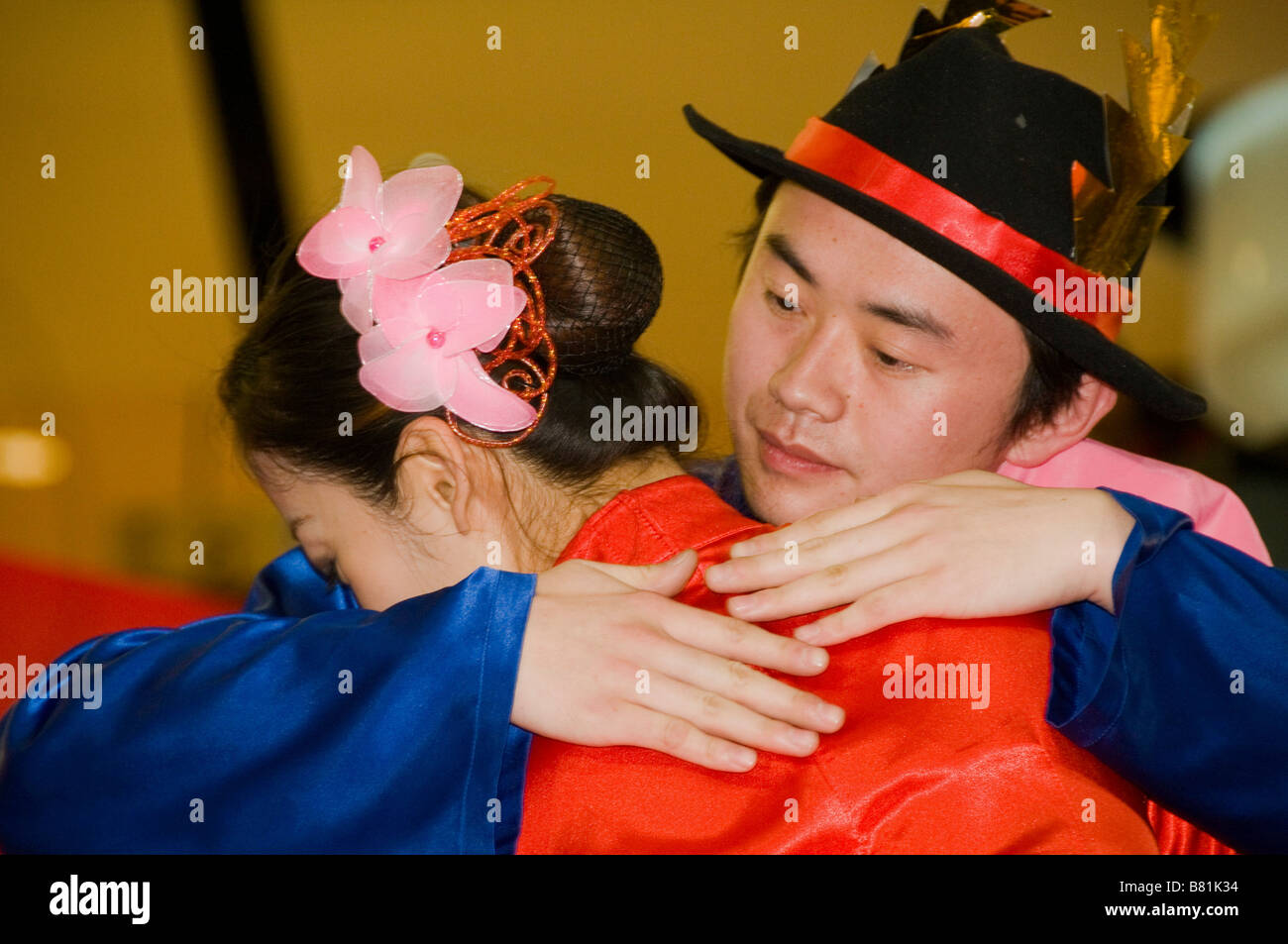 Chinese performers hugging at Chinese New Year show in Bangkok Thailand ...