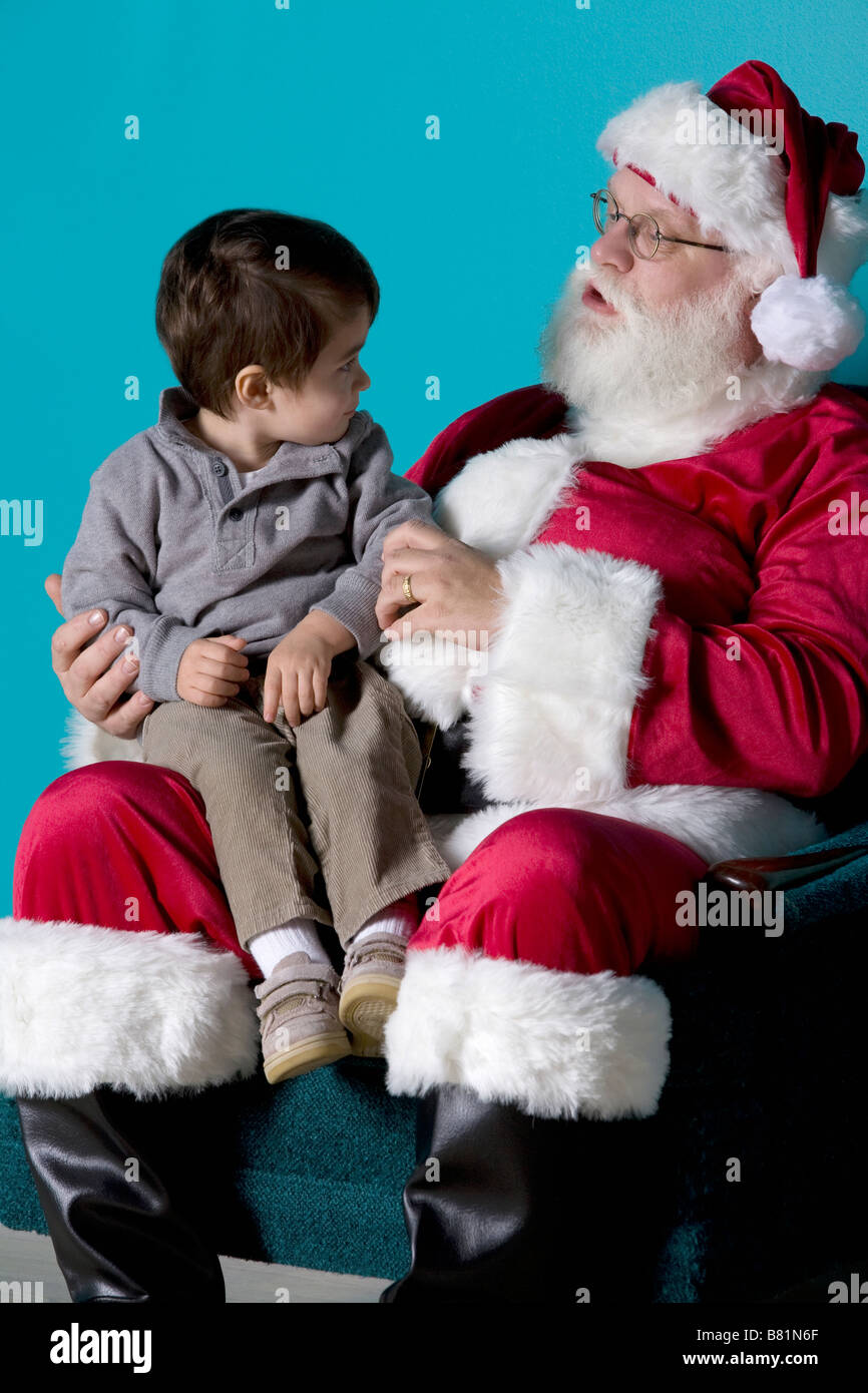 Little boy on Santa's lap Stock Photo - Alamy