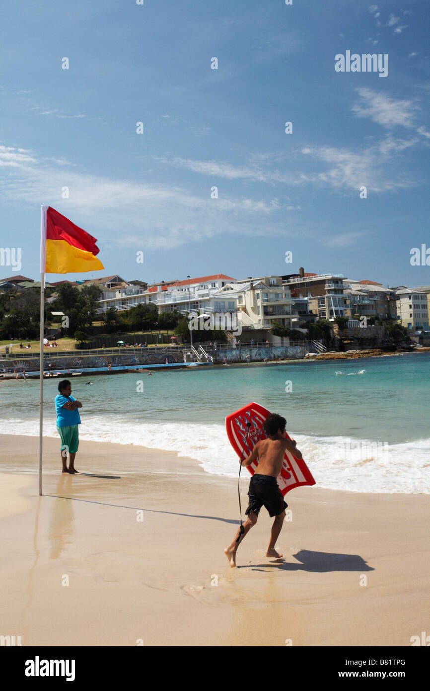 Boy 12 14 years running into the water at famous Bondi Beach Australia ...
