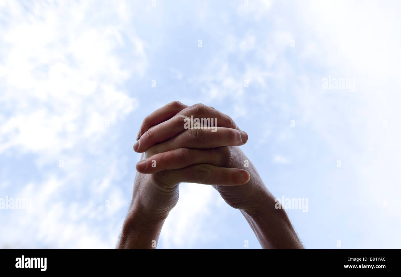 Hand signal pray Stock Photo - Alamy