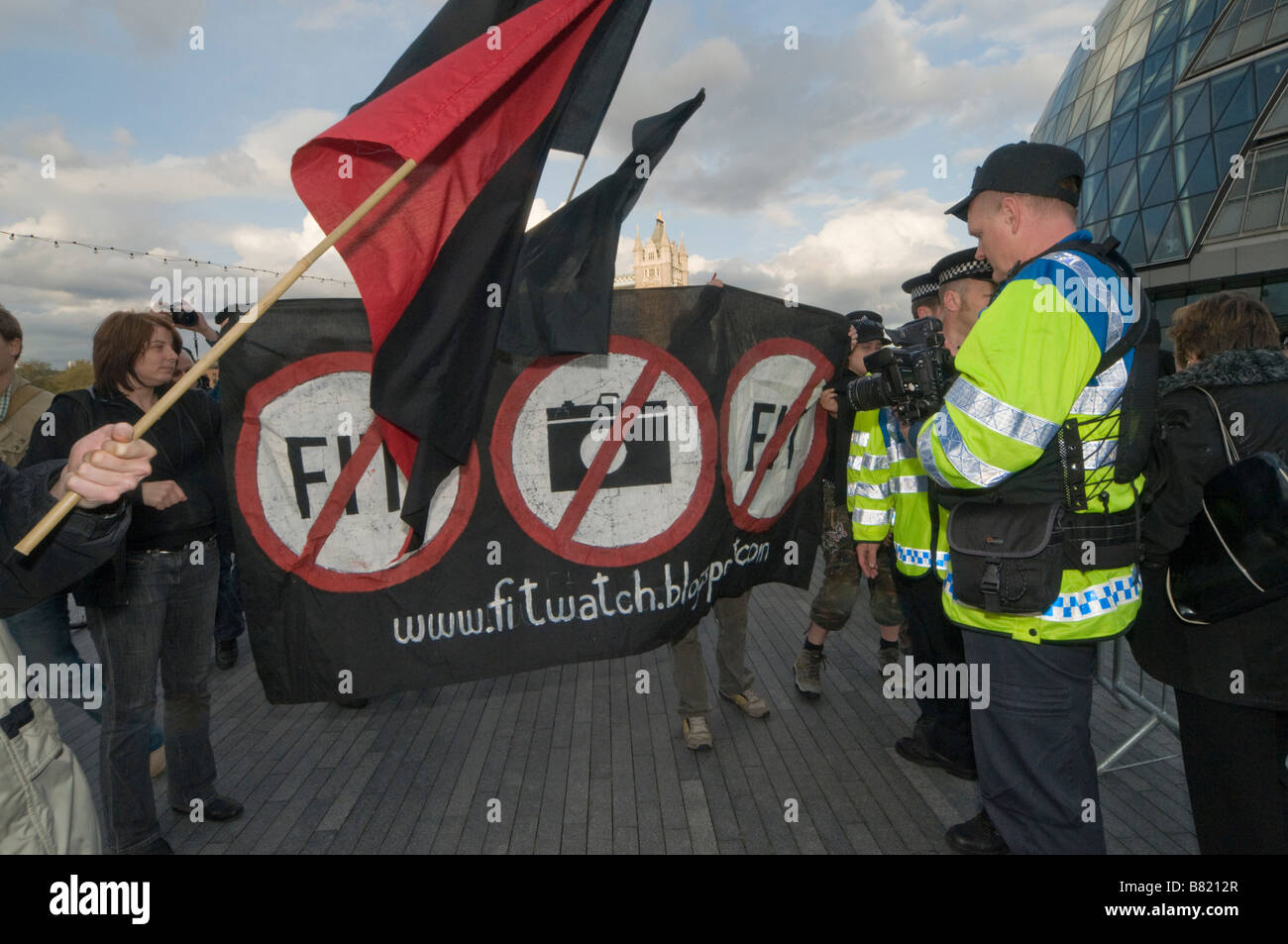 Fitwatch banner facing police Forward Intelligence team with cameras to ...