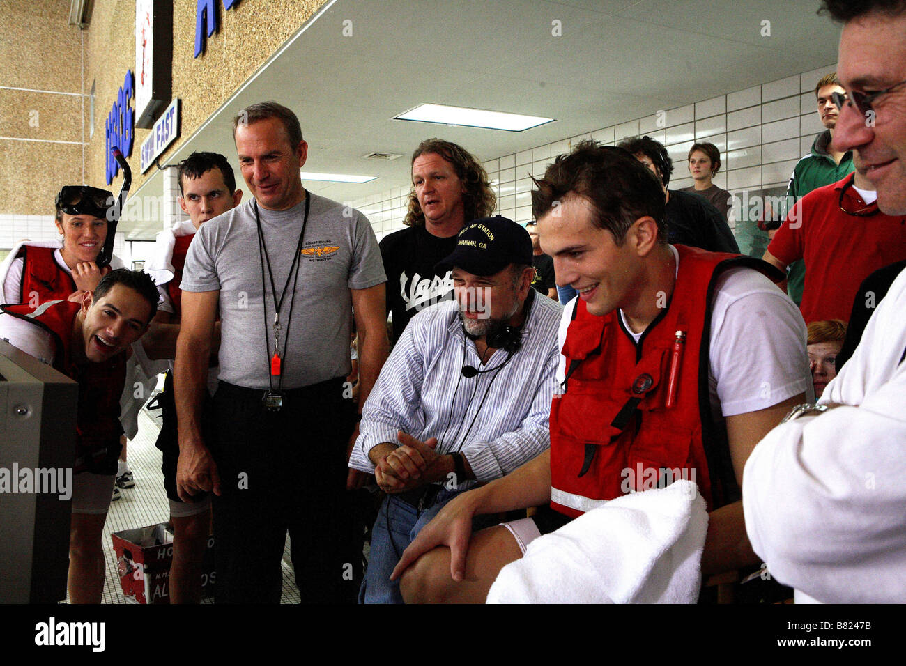 Director Andrew Davis with Kevin Costner and Ashton Kutcher on the set ...