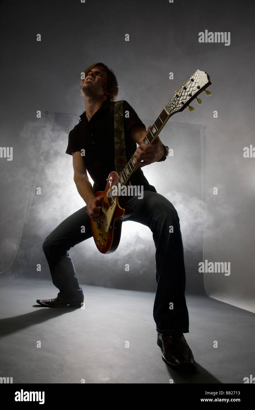 Man playing the guitar Stock Photo - Alamy