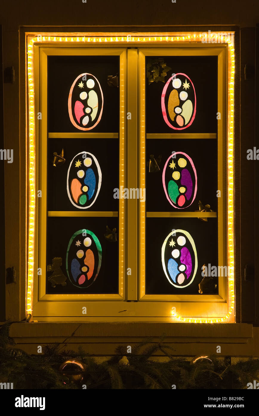 ILLUMINATED CHRISTMAS WINDOW DECORATED WITH NATIVITY SCENES DURING ...