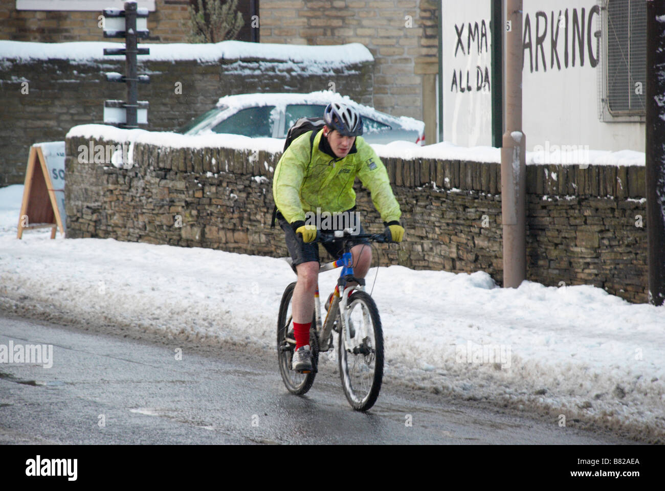 cyclist in the snow Stock Photo - Alamy