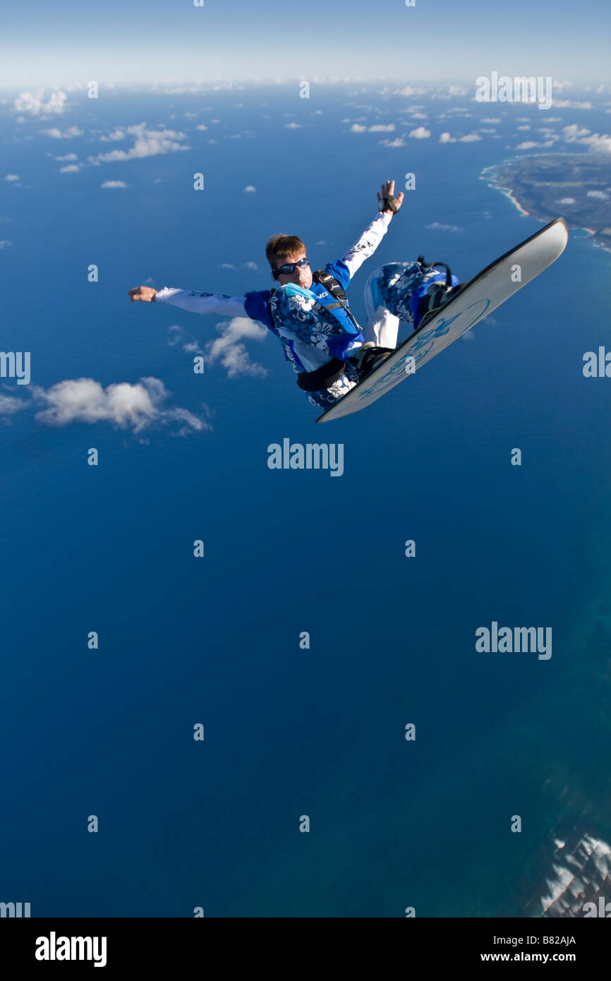 Skydiver is surfing the big blue sky over clouds into the deep blue sea ...
