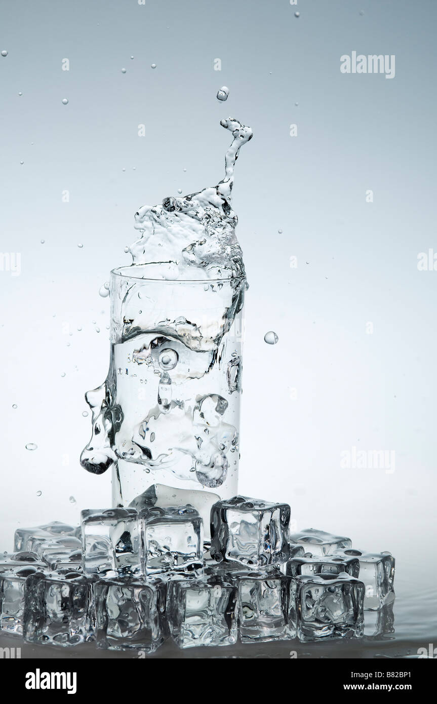 Water drink splashing out from glass Stock Photo - Alamy