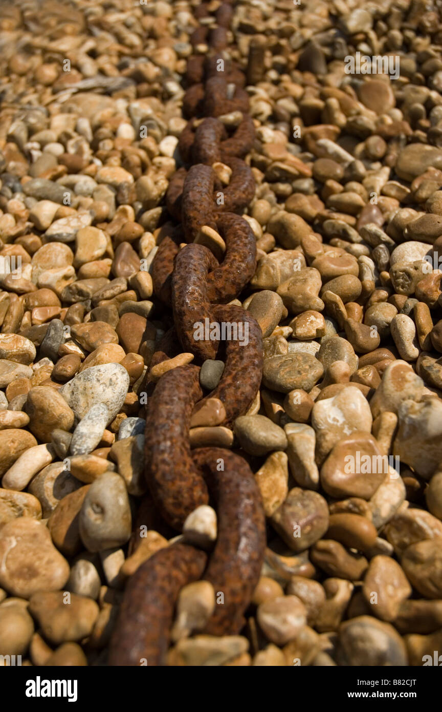 Rusty Chain laid along Pebbley Beach Stock Photo - Alamy