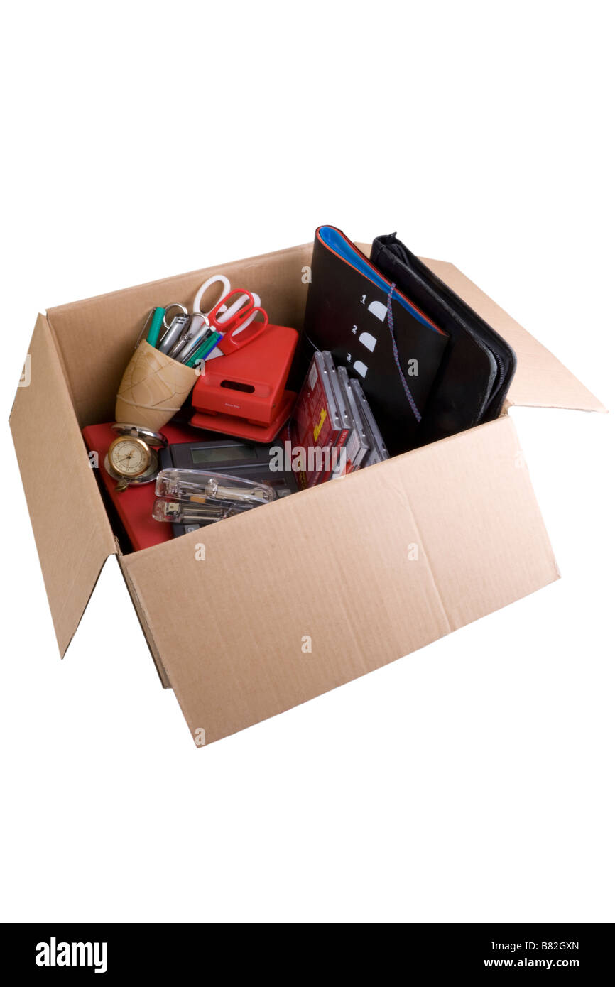 Desk contents in a cardboard box Stock Photo - Alamy
