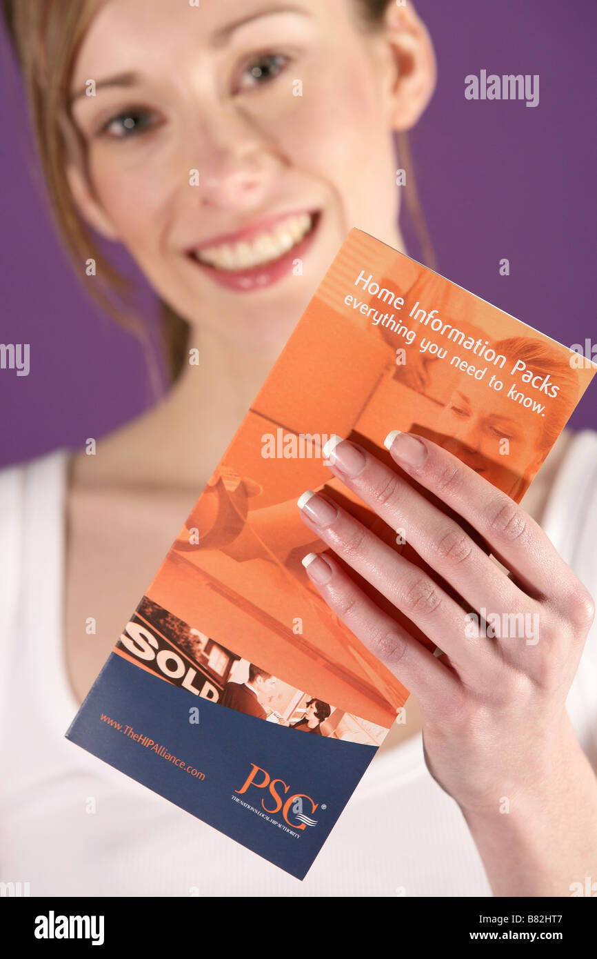 girl reading a home information pack leaflet Stock Photo - Alamy