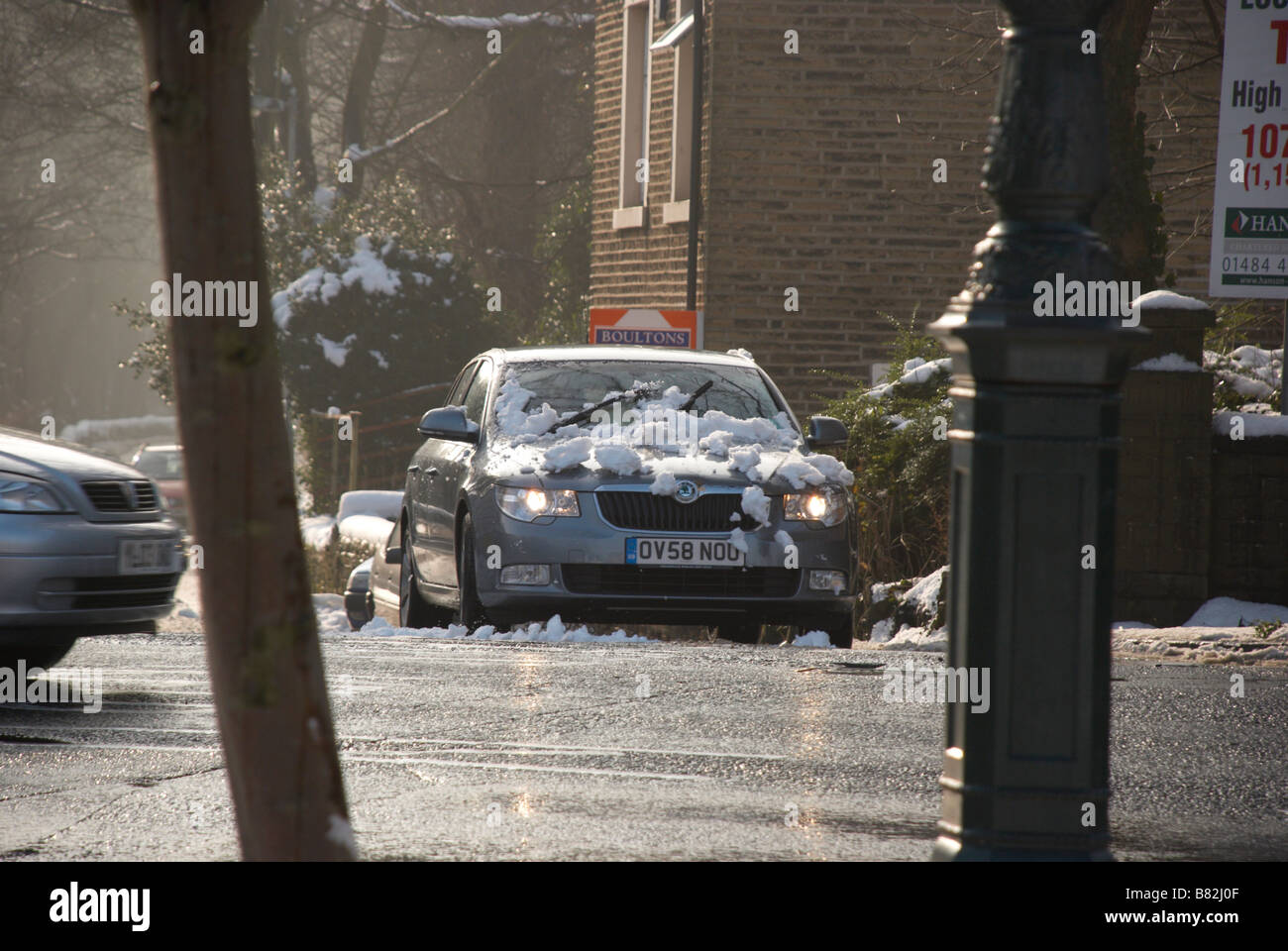 car with snow on its bonnet & window screen after it came off the roof ...