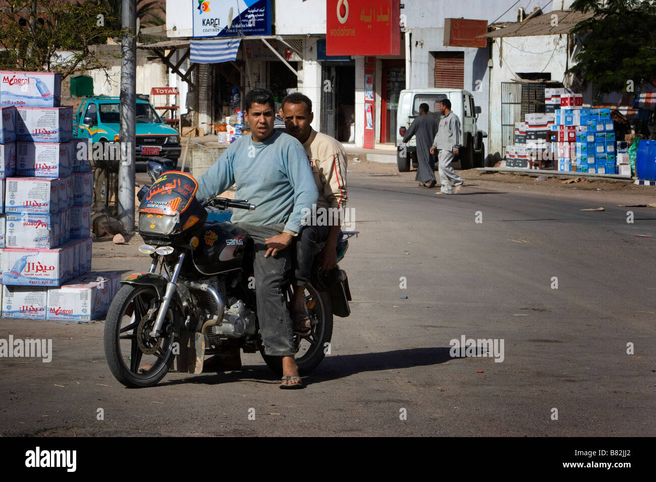 Two men on motorcycle at roadside, Dahab, Egypt Stock Photo - Alamy