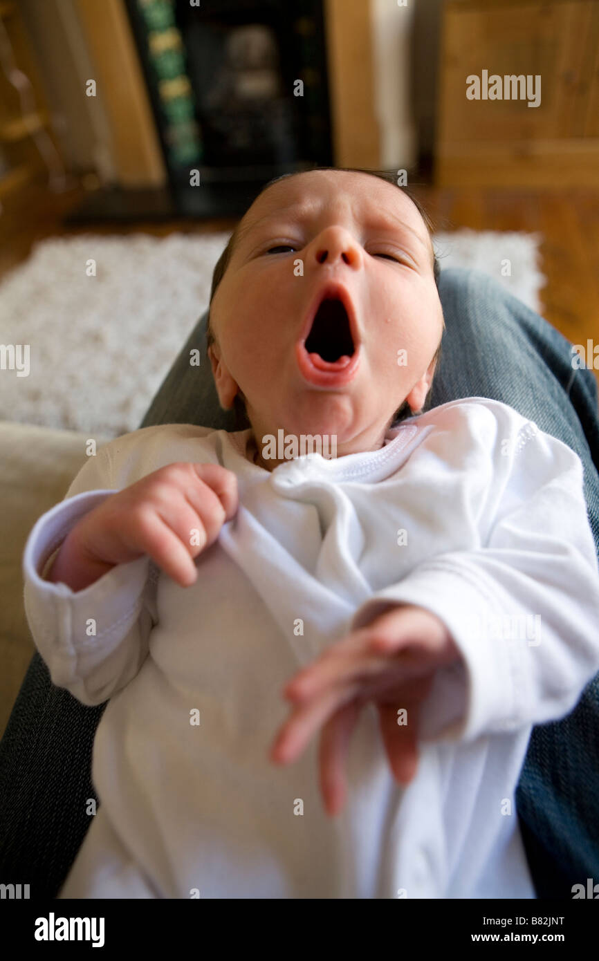 A baby yawning Stock Photo - Alamy