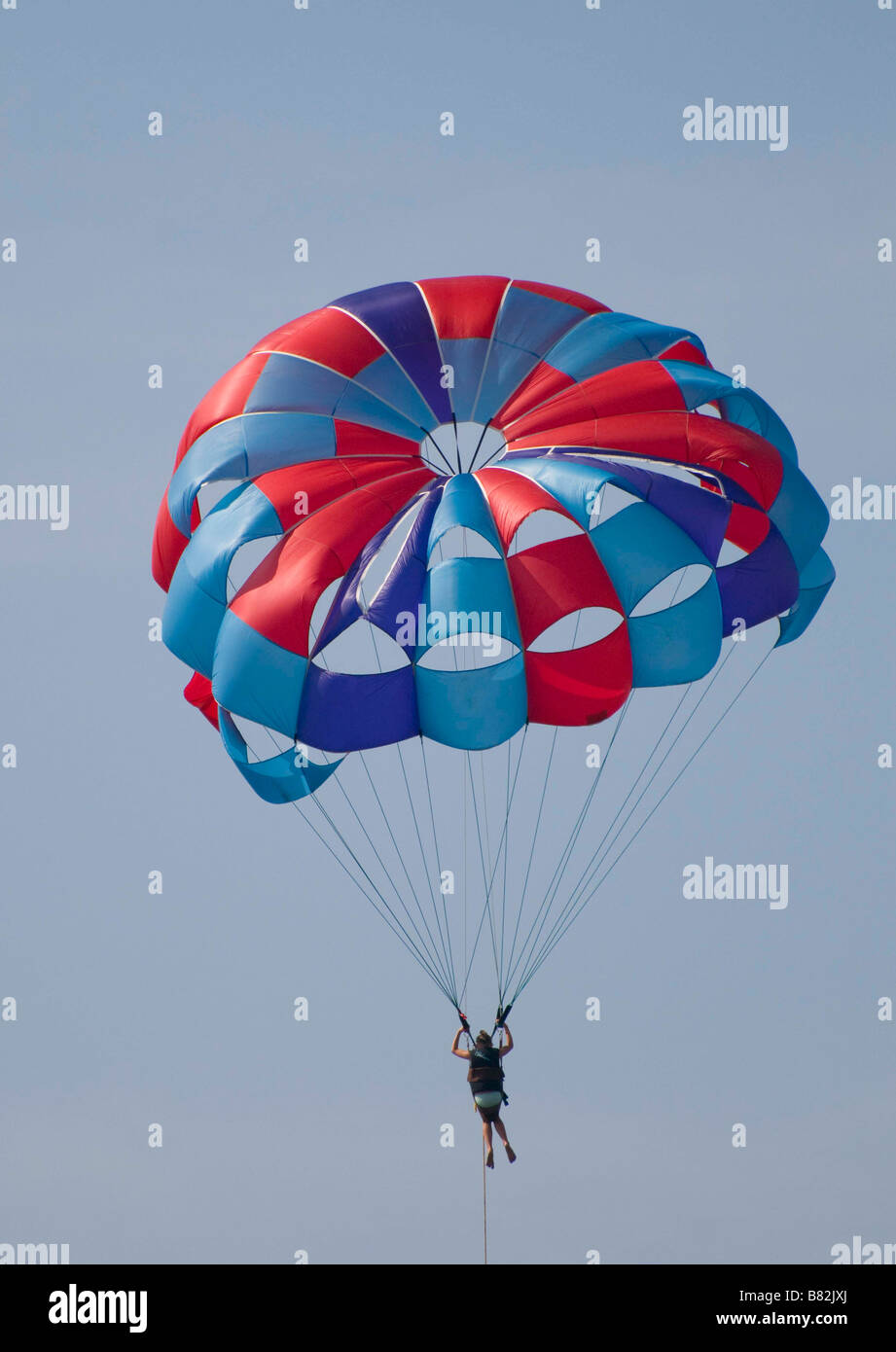MEXICO SINOLA STATE MAZATLAN Person parasailing high in the sky Golden ...