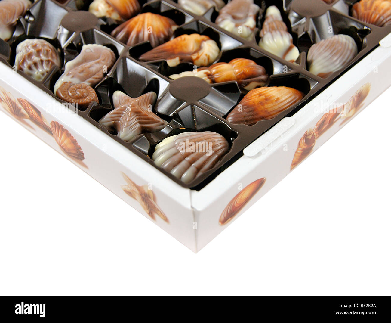 A corner of a box of seashell chocolates Stock Photo - Alamy