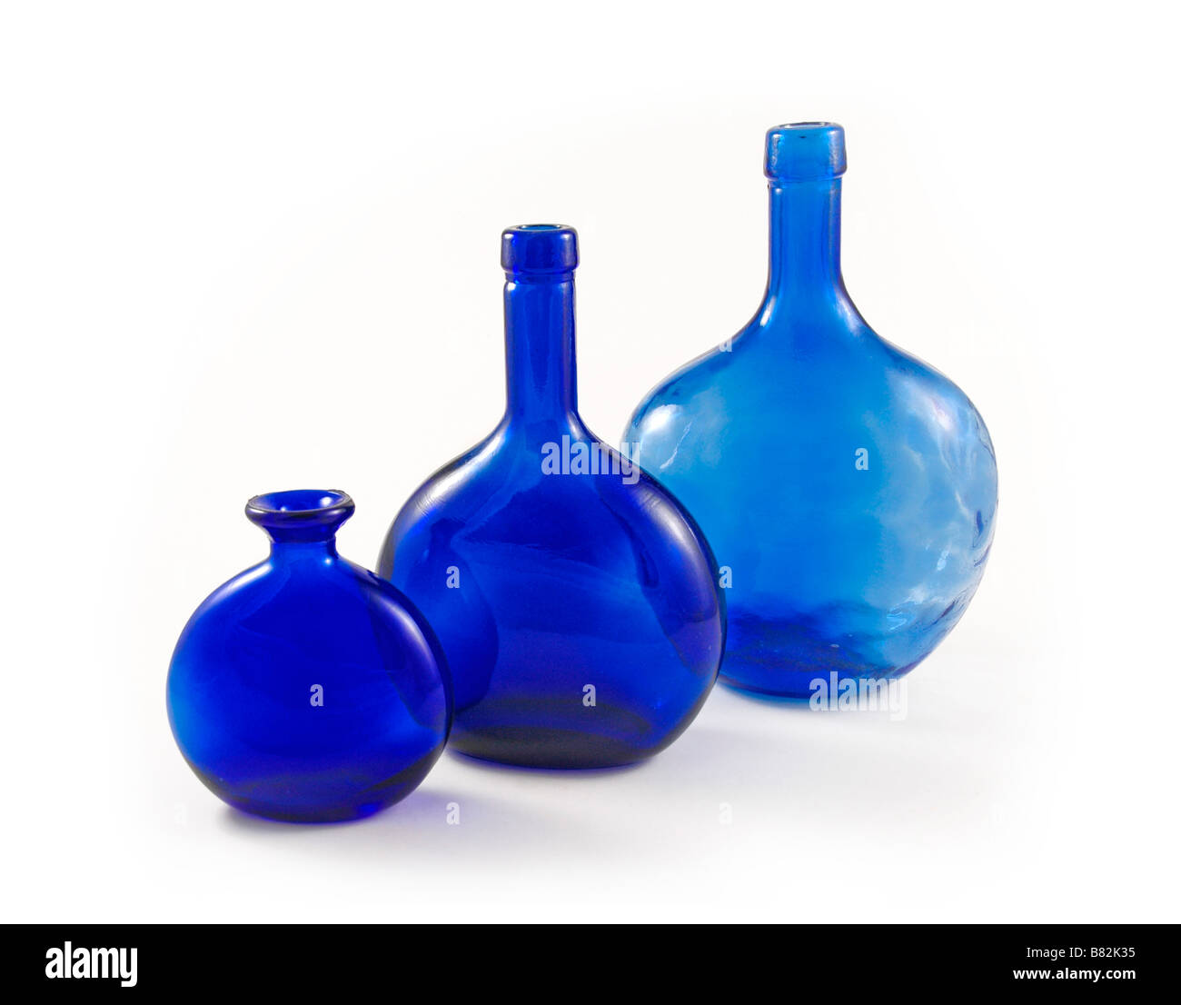 Three blue bottles Stock Photo - Alamy