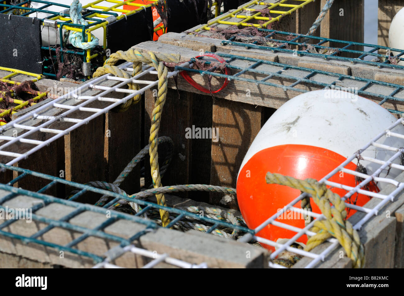 Wooden conch fishing pots with wire edges rope and buoys Stock Photo ...