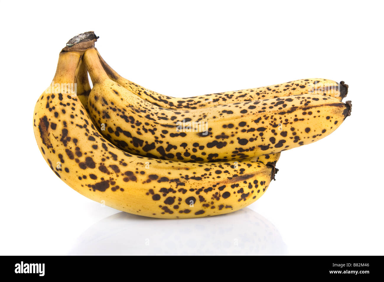 Cluster of over ripe bananas isolated on white background Stock Photo ...