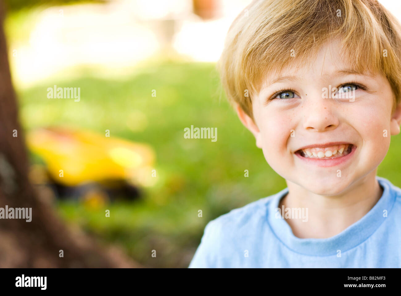 boy laughing outdoors playing Stock Photo - Alamy