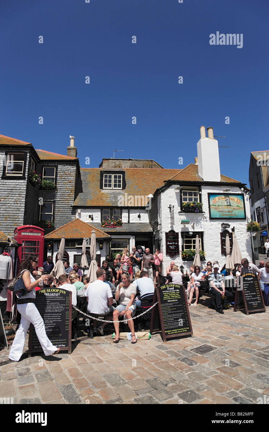 People sitting in front of the Sloop Inn St Ives Cornwall England ...