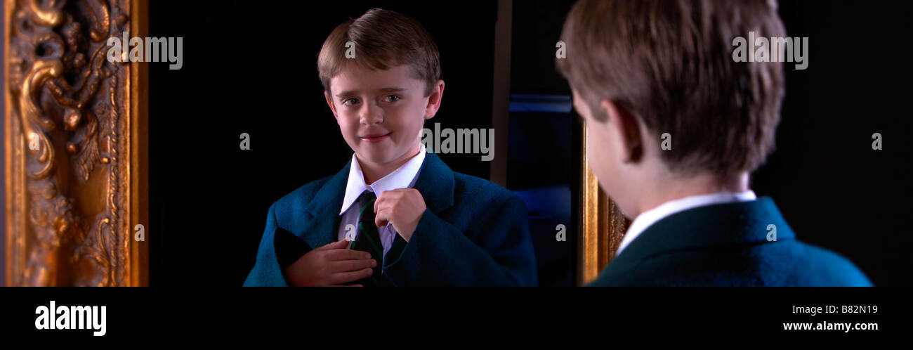 boy preparing proudly for school in shirt and blazer Stock Photo - Alamy