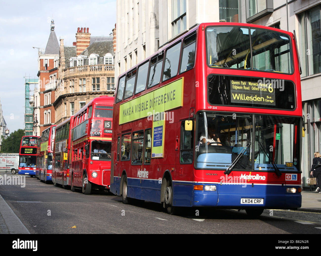 Red London buses on The Strand London Stock Photo - Alamy