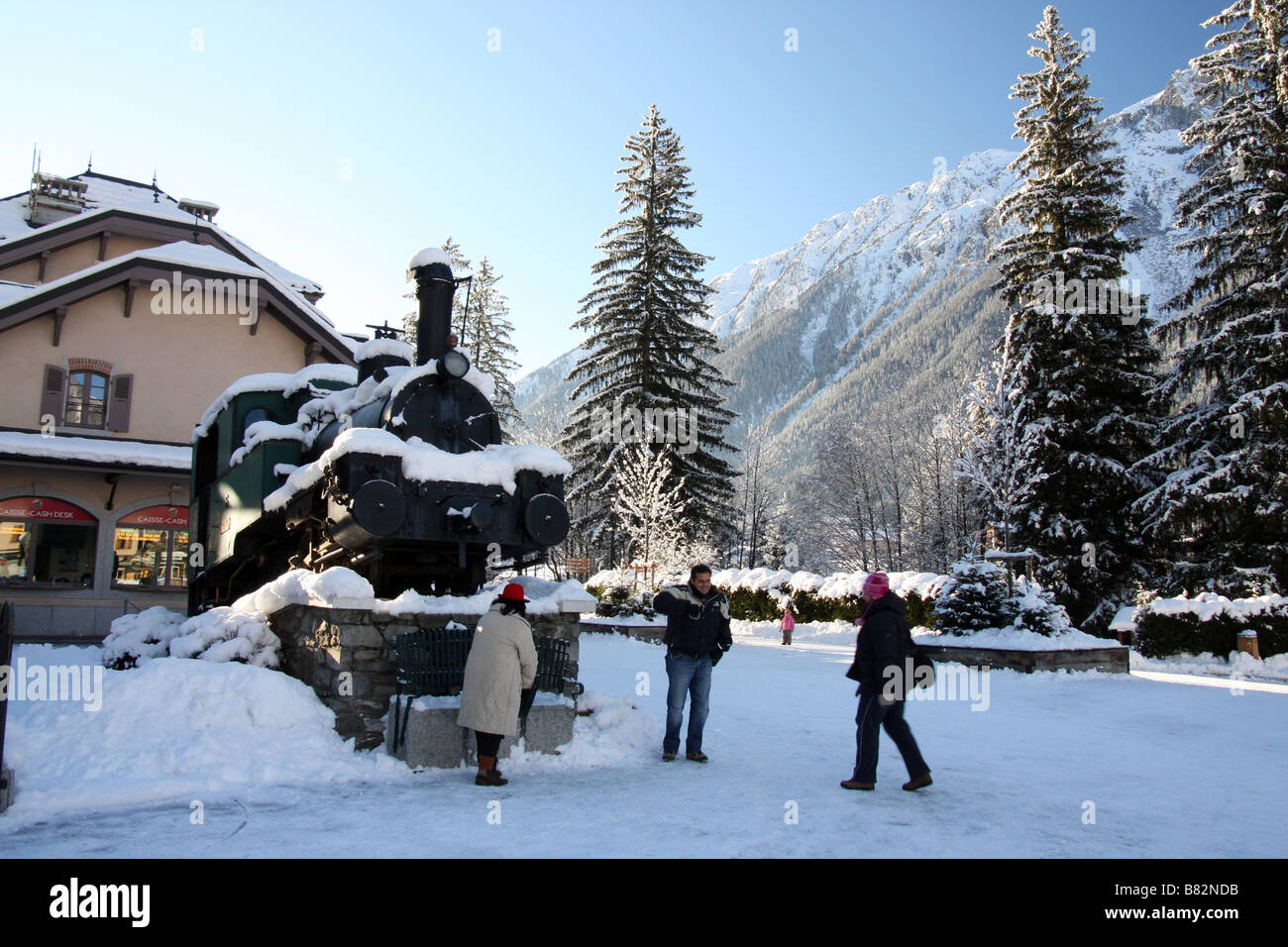 Tourists taking pictures of an old obsolete rack railway steam ...