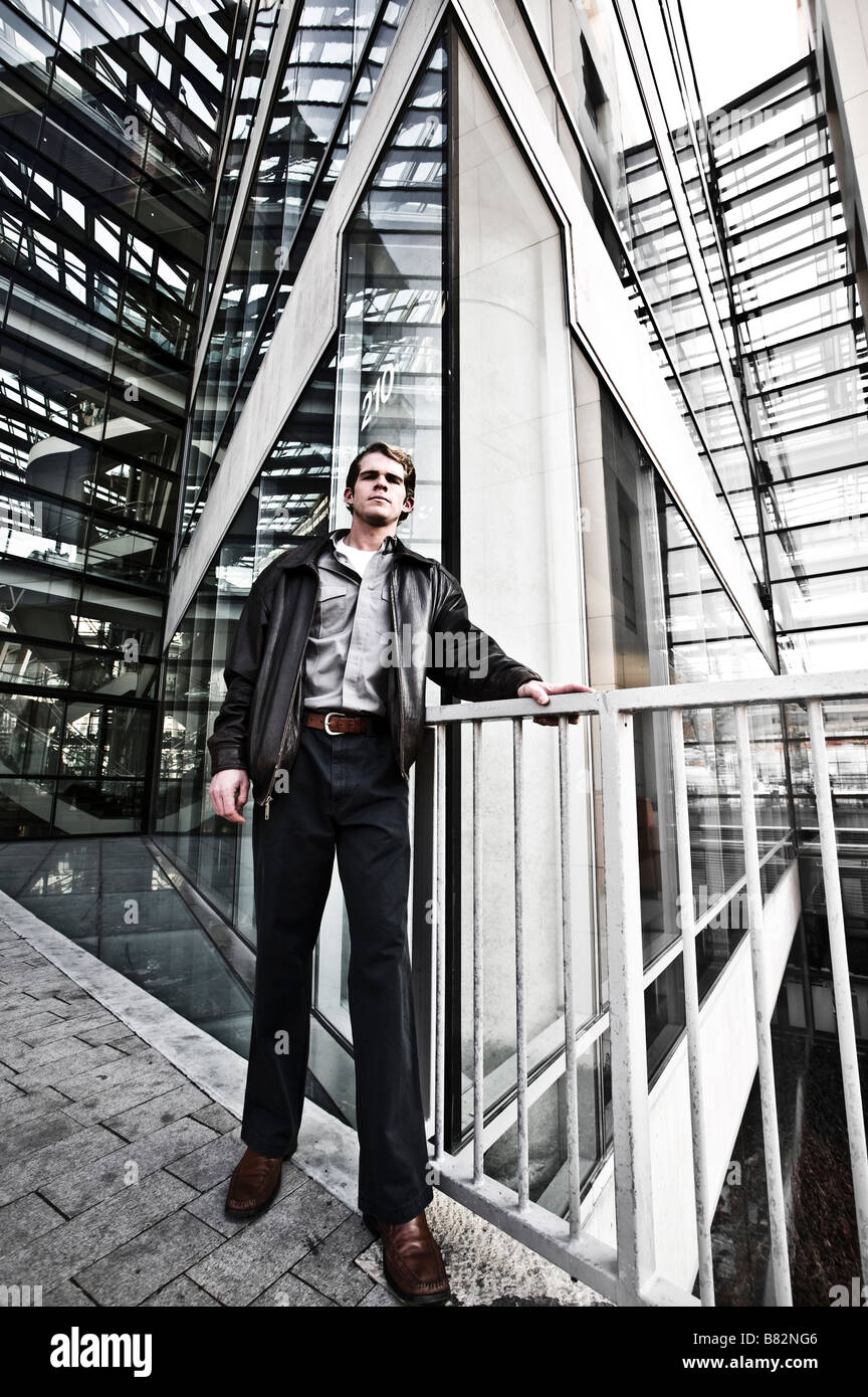 Man standing in front of a public building Stock Photo - Alamy