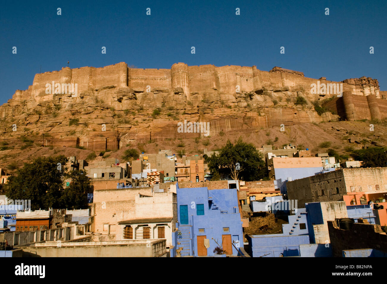 The beautiful Jodhpur fort rises above the old blue buildings of the ...