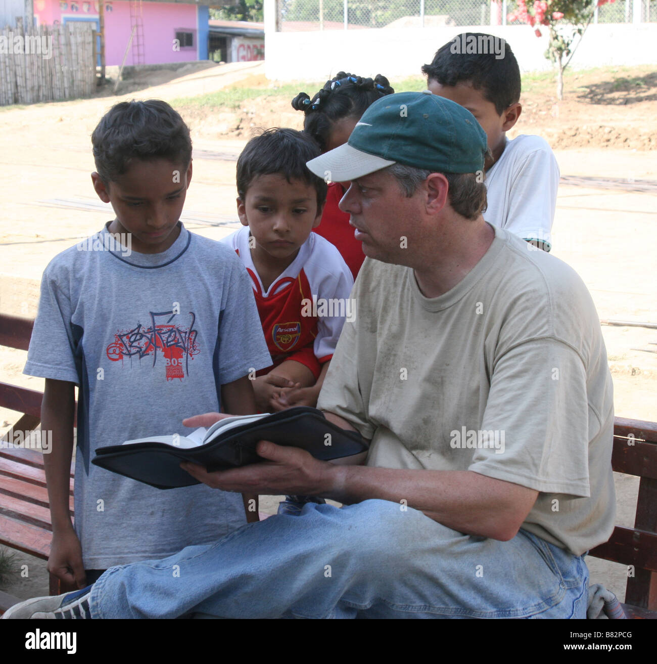 Man teaching kids outside Quito, Ecuador jungle area Stock Photo - Alamy