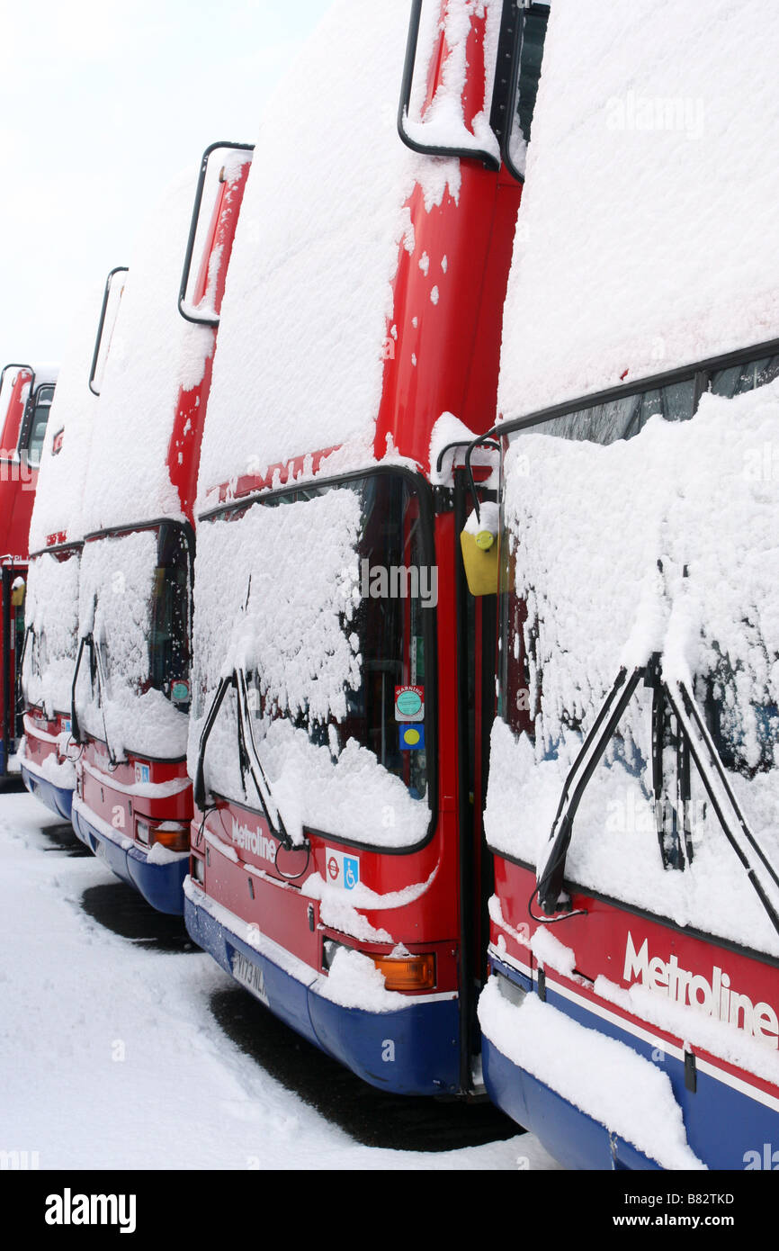 London buses covered in snow at Willesden Bus Garage, North west London ...