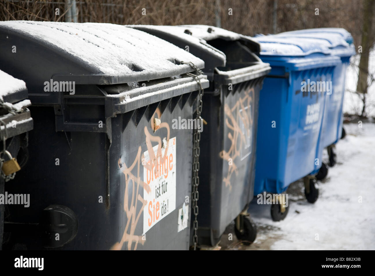 recycling bins with snow Stock Photo - Alamy