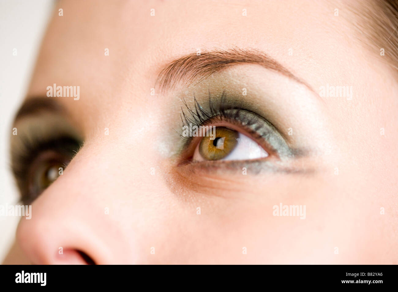 Close up of a young woman s face looking up Stock Photo - Alamy
