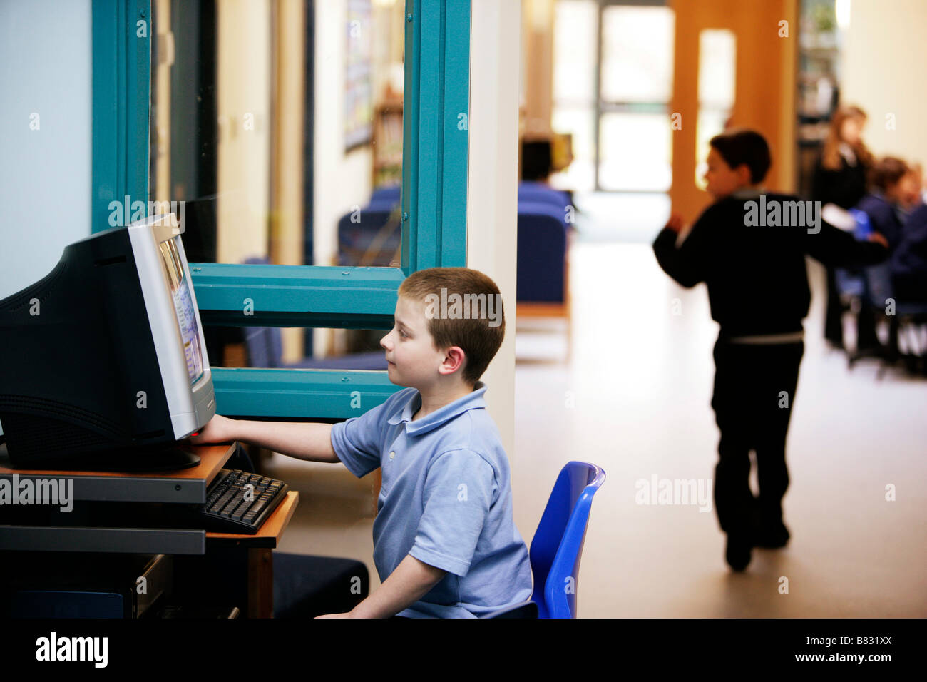 primary school pupil working on computer Stock Photo - Alamy
