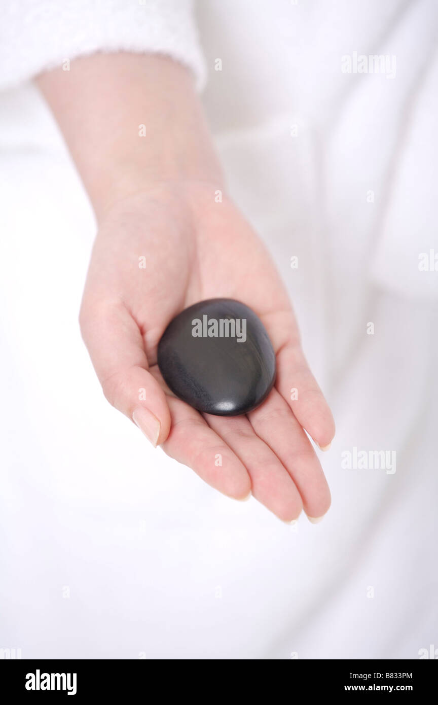 Pebble in hand hi-res stock photography and images - Alamy