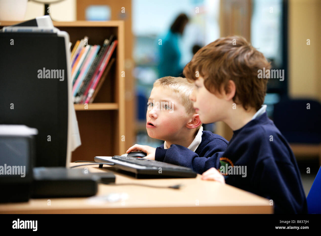 primary school pupils working on laptop computer Stock Photo - Alamy