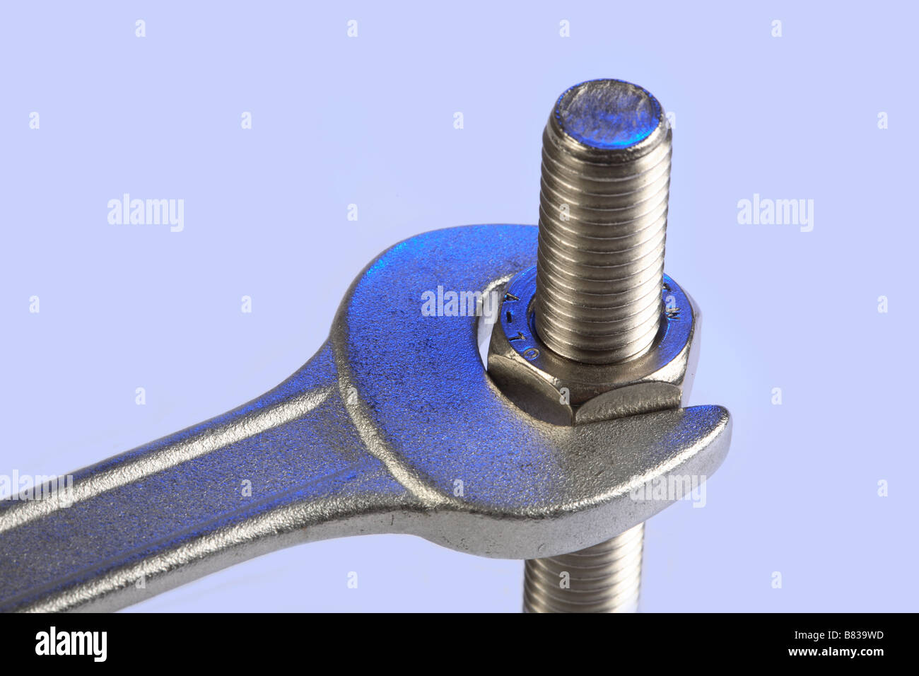 Close-up of spanner, nut and screw Stock Photo - Alamy