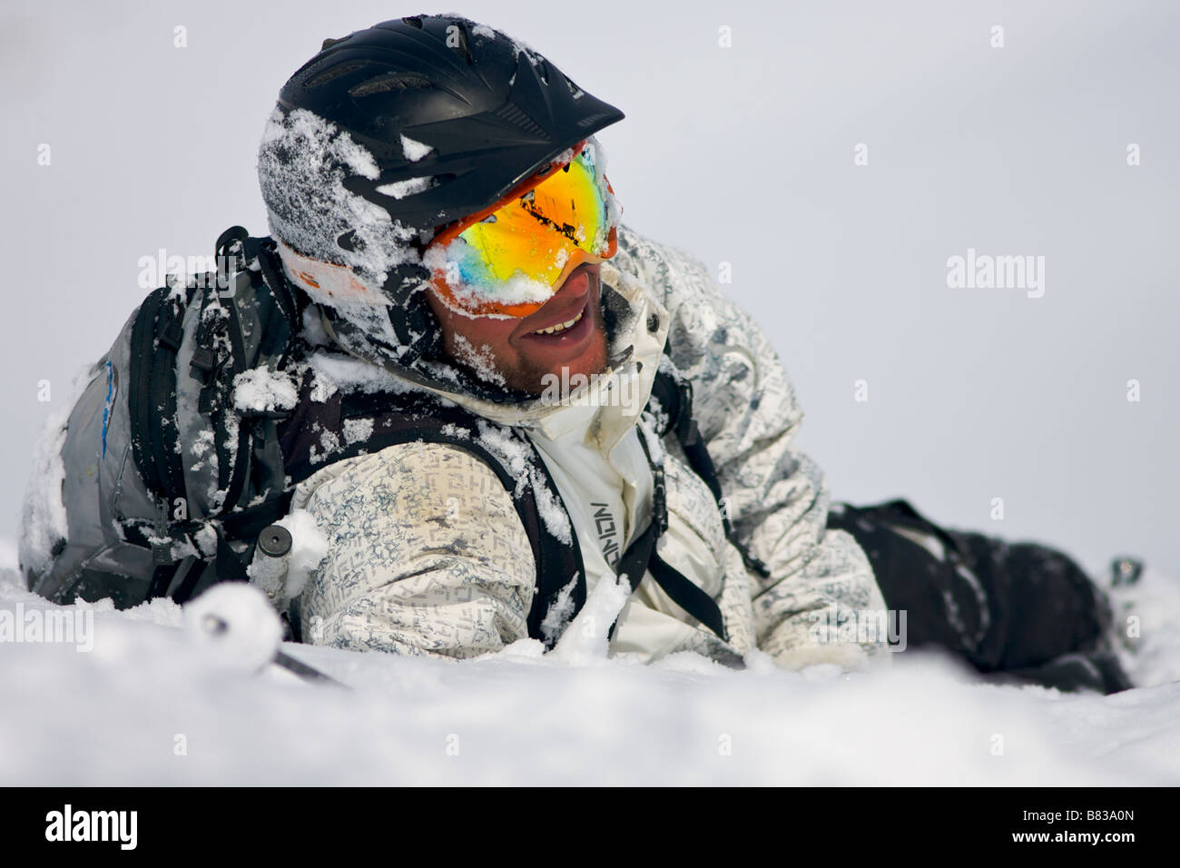 extreme skier laughs in the snow after a crash Stock Photo - Alamy