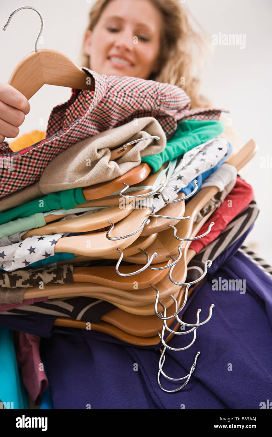 Woman with clothes Stock Photo - Alamy